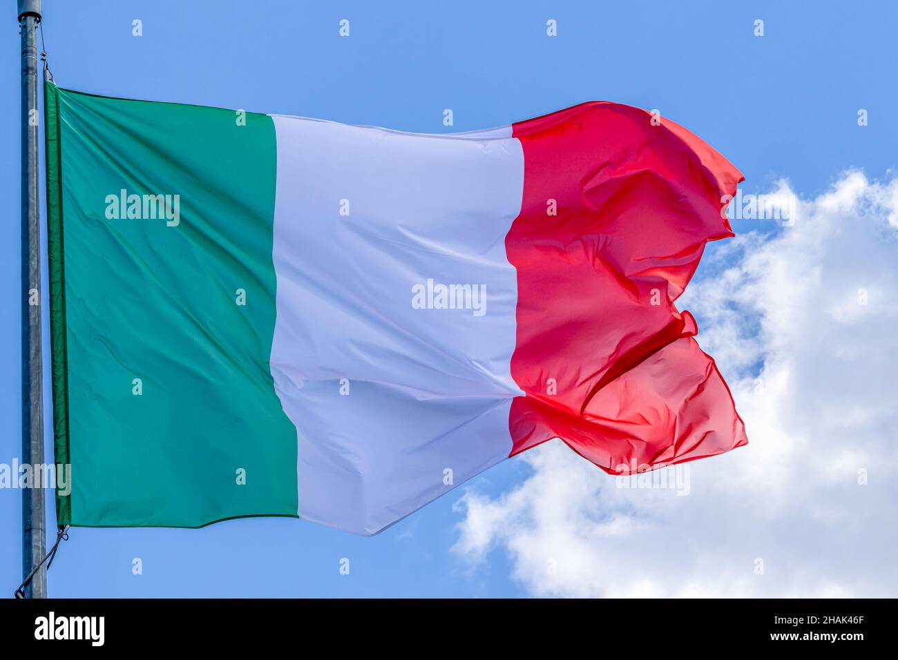 Italian national flag waving on blue sky background. Italian Republic ...