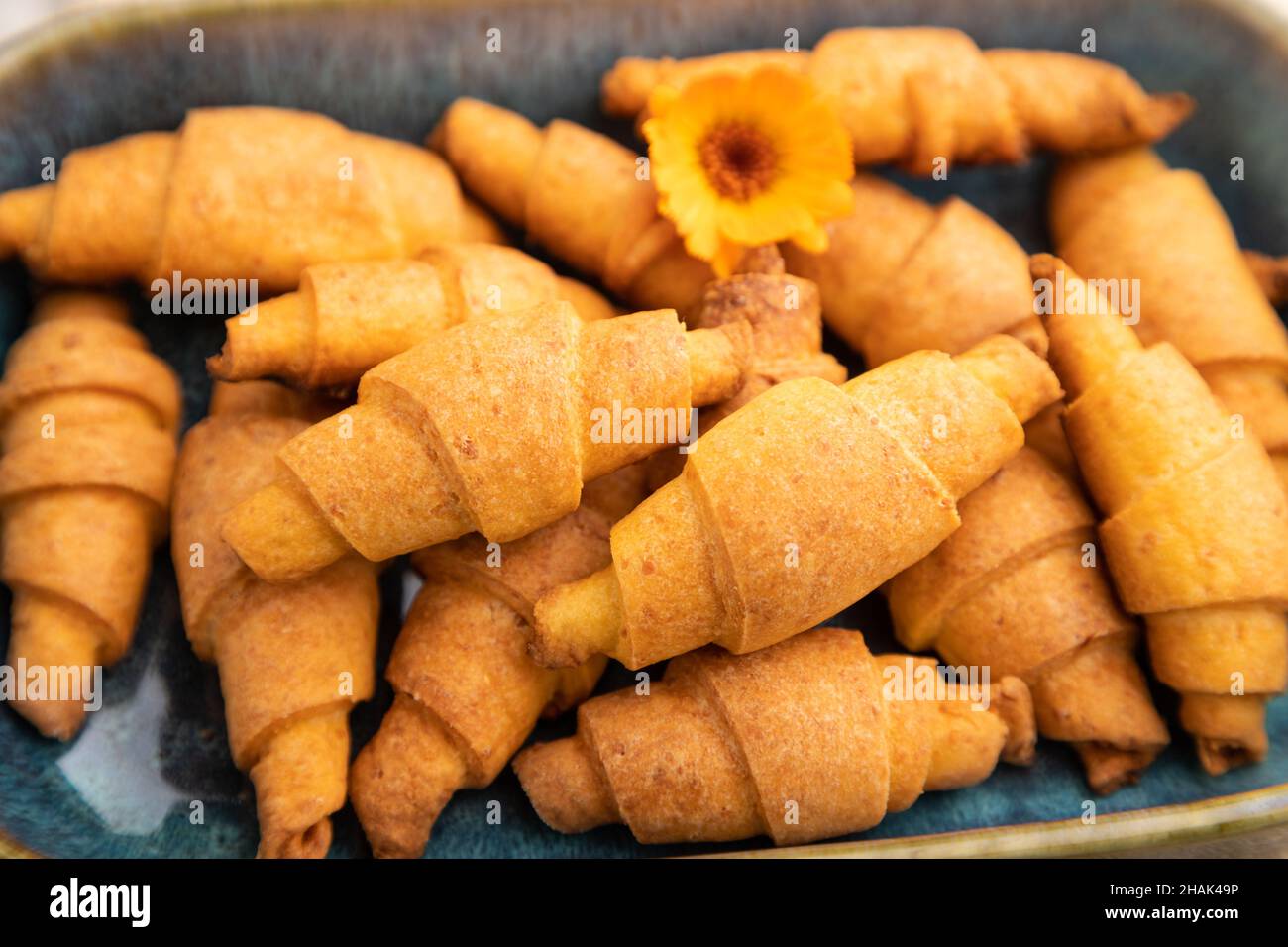 Homemade bagel roll with cup of coffee on a gray concrete background ...