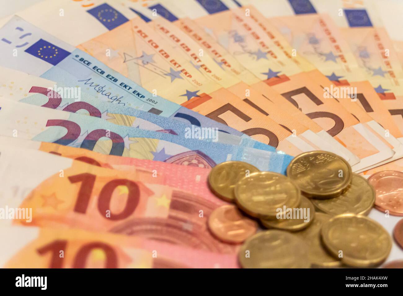 A composition of euro banknotes and coins providing great options to be ...