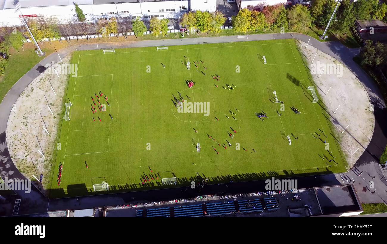 Football players running around the football field. Top view of the ...