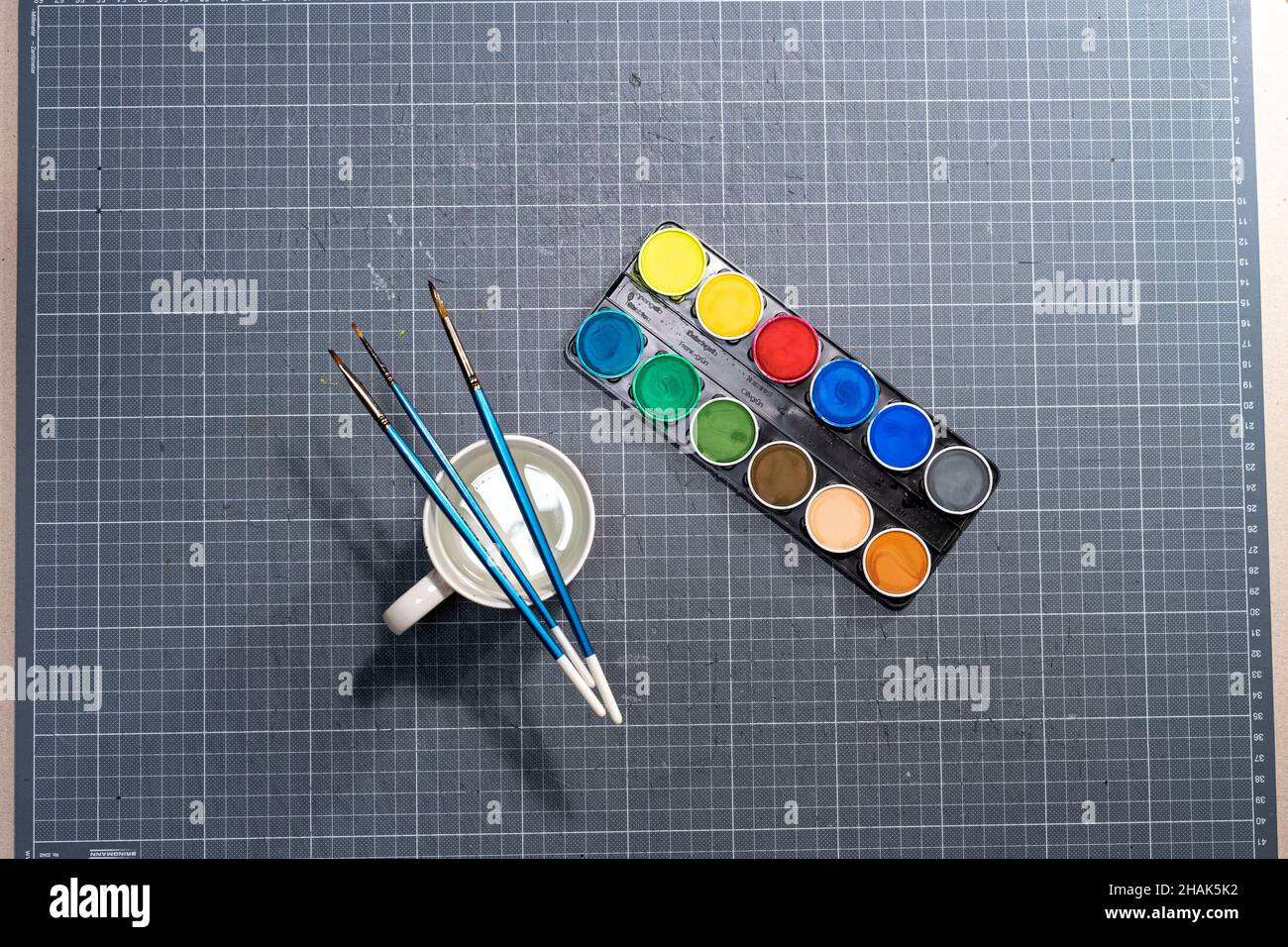 Watercolor paint, water and brush are ready Stock Photo - Alamy