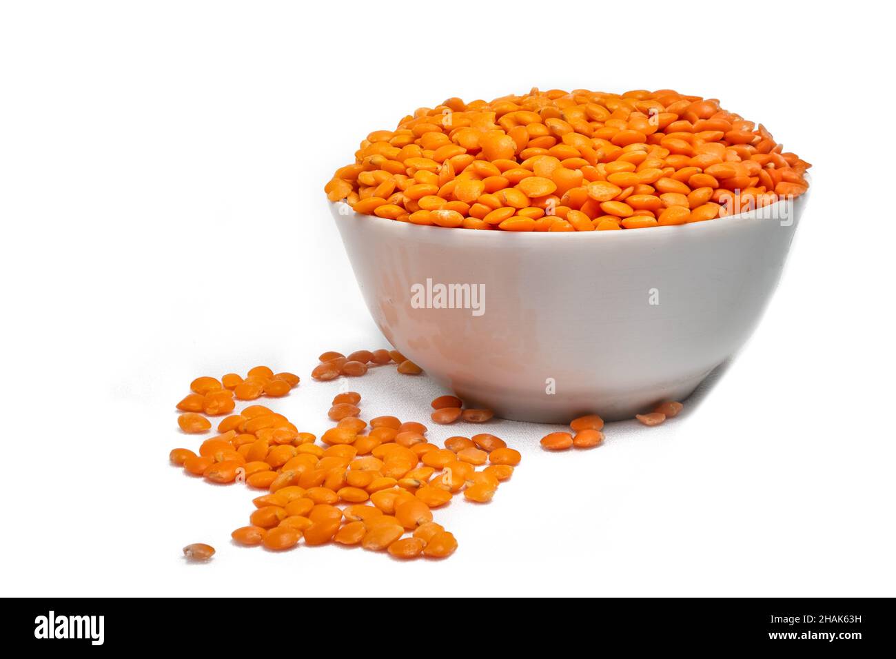Orange lentil in a white bowl Stock Photo - Alamy