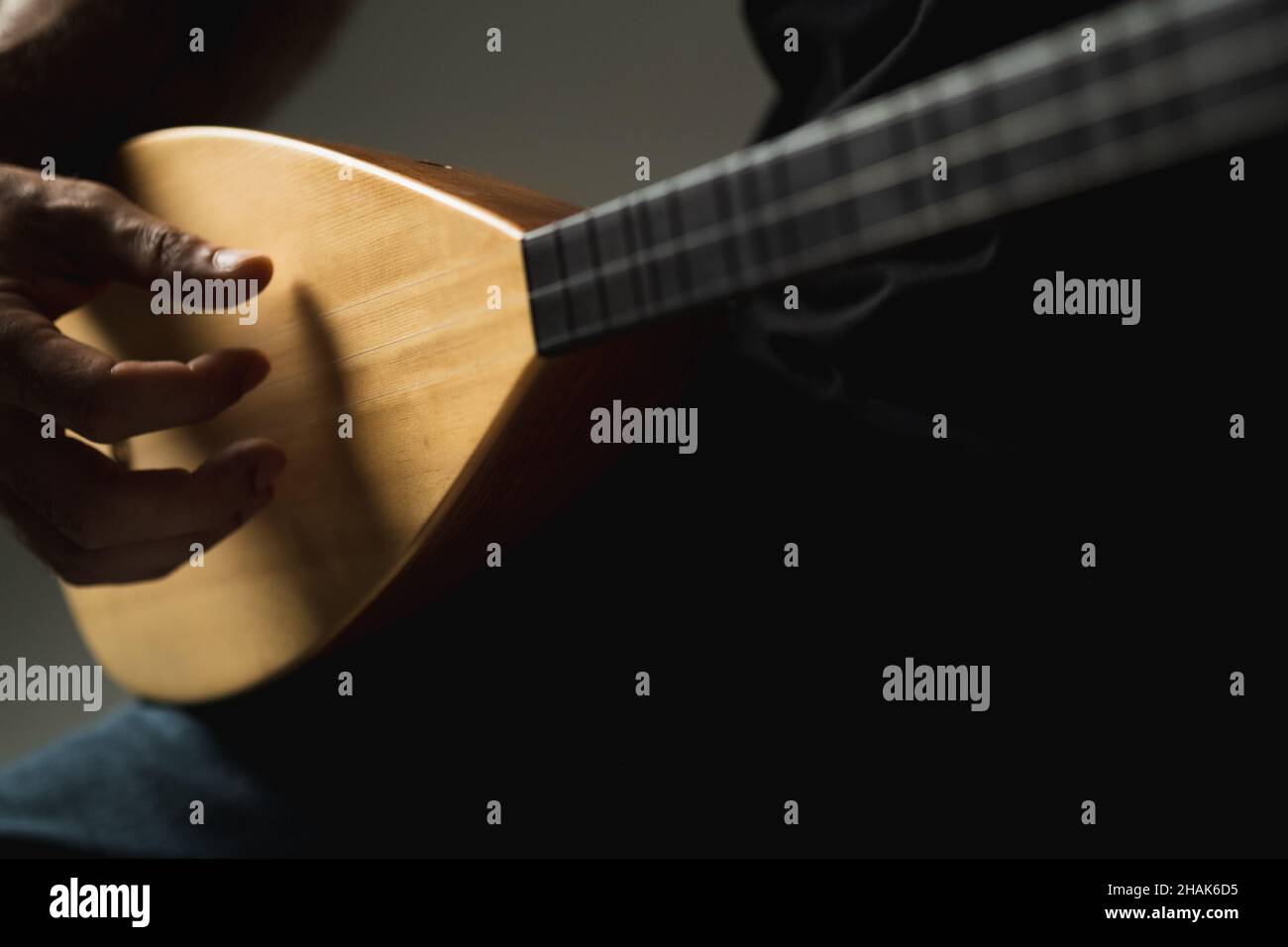 Close up shot of Playing Kopuz which is a string instrument named ...