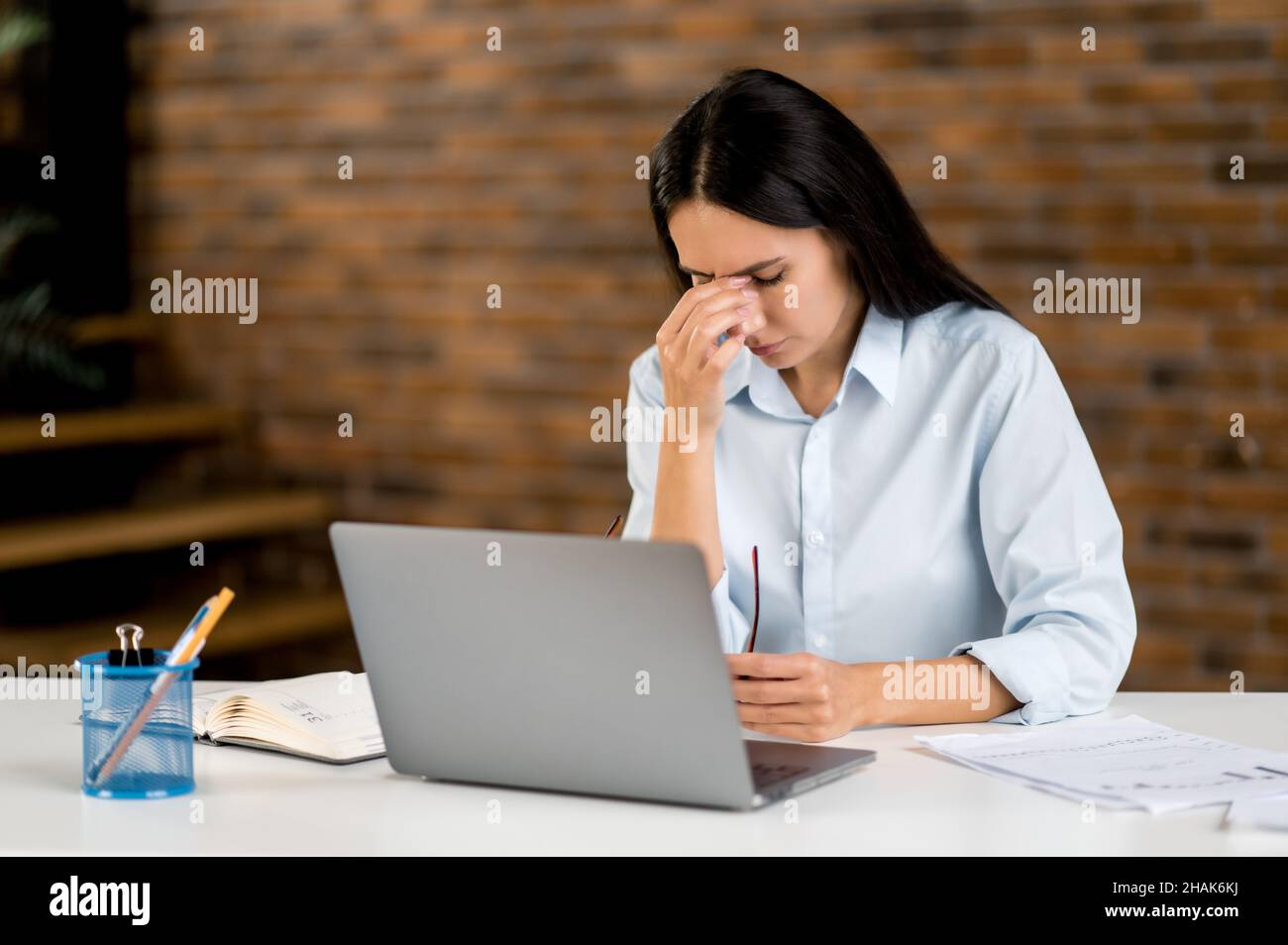 Overworked exhausted caucasian young adult business woman, top manager ...