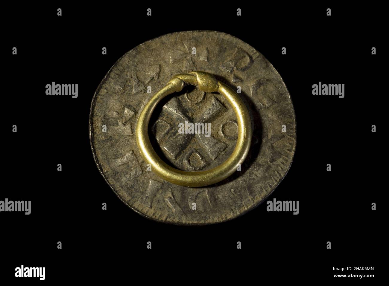 Small viking gold ring on a viking age silver coin Stock Photo - Alamy
