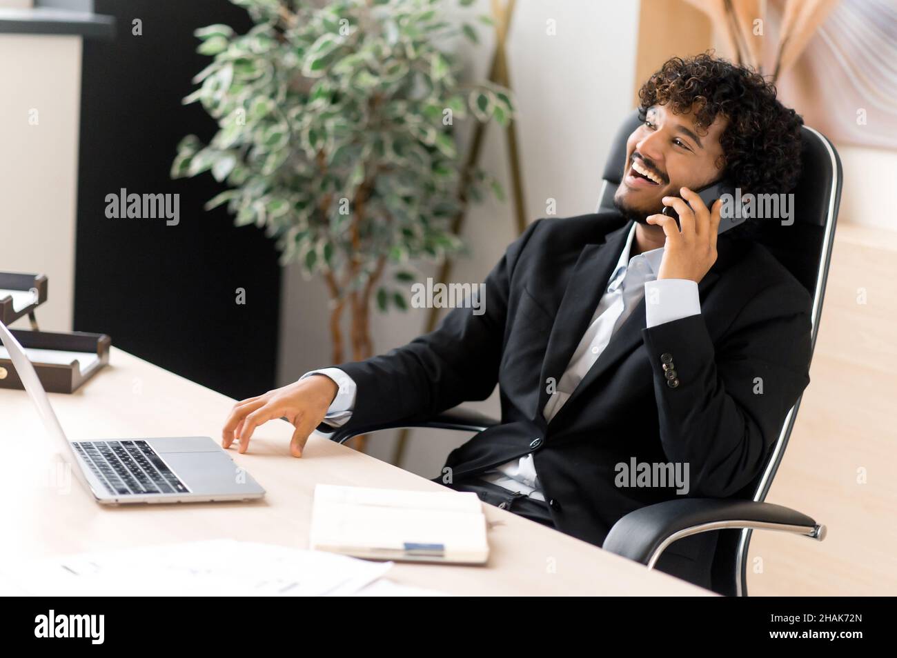 Successful happy Indian IT professional, marketer or manager, sitting ...