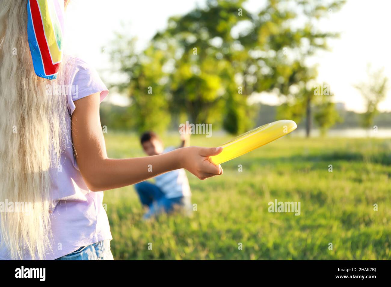 Cute little children playing frisbee outdoors Stock Photo - Alamy