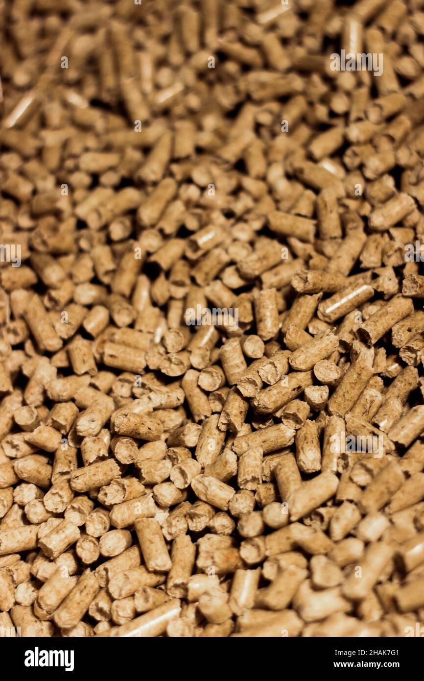 Pile of brown pellet fuel - industrial waste and co-products, food ...