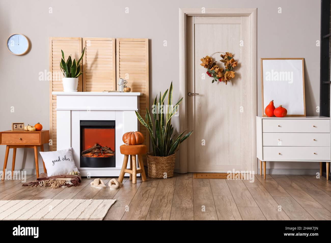 Interior of living room with autumn decor and fireplace Stock Photo - Alamy