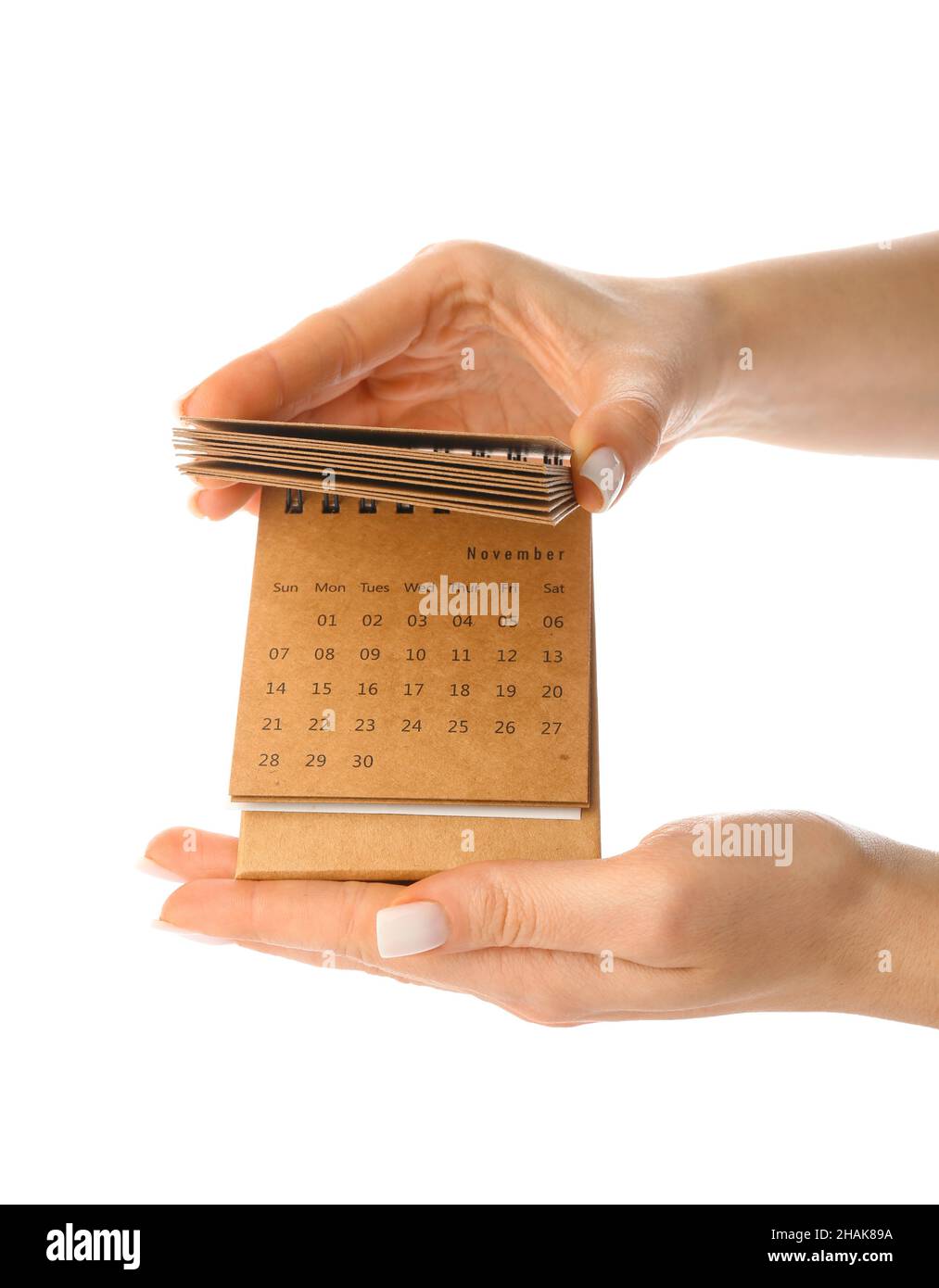 Woman holding craft calendar on white background Stock Photo - Alamy