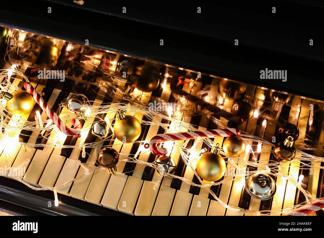 Christmas decor with glowing lights on piano keys Stock Photo - Alamy
