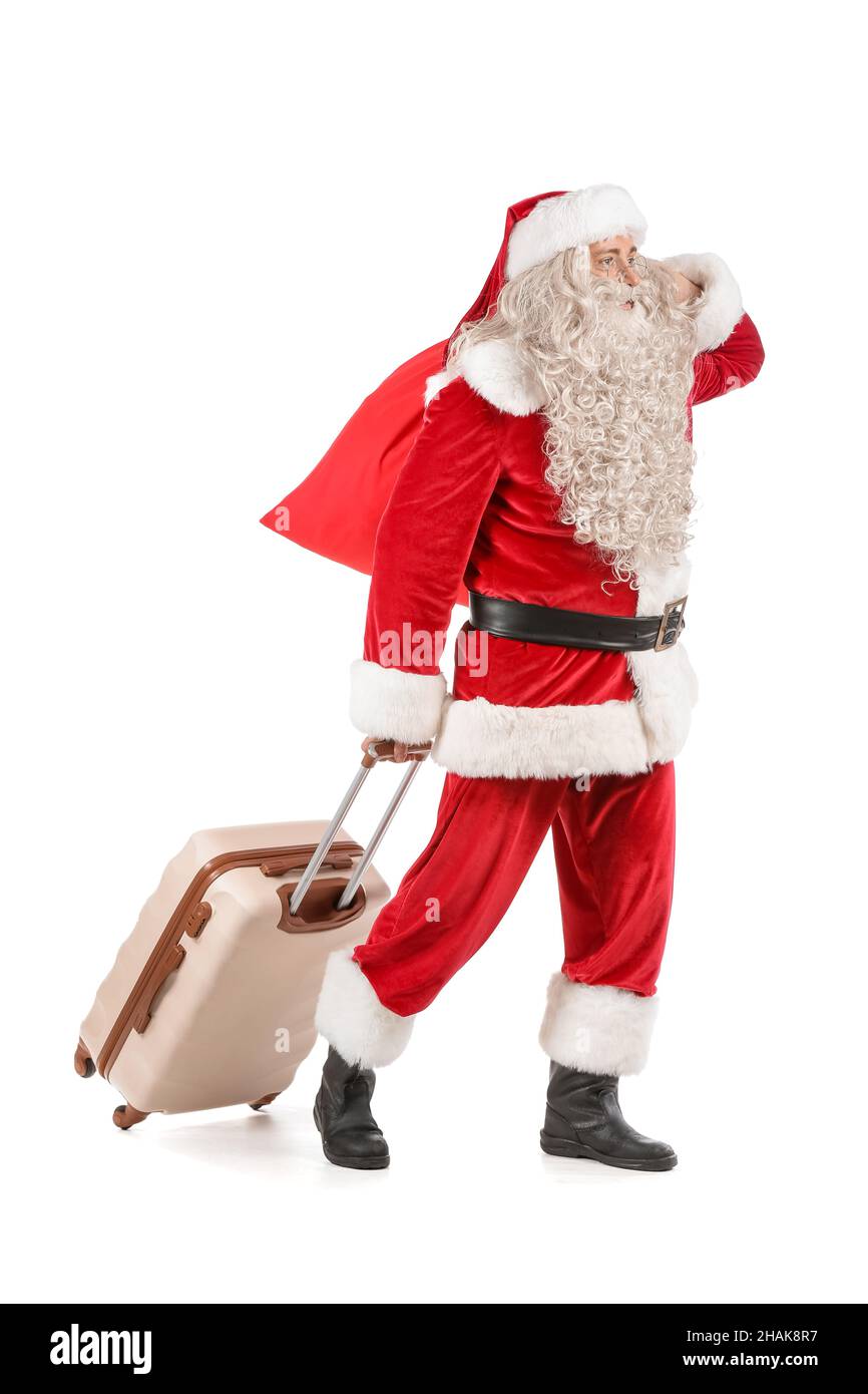 Santa Claus with bag and suitcase on white background Stock Photo - Alamy