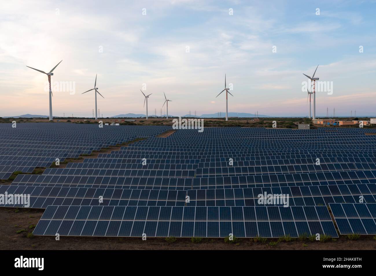 Solar panels and wind turbines producing green energy for clean ...