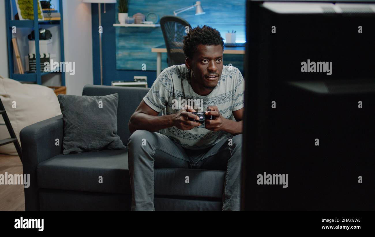 African american man losing at video games on console for fun. Black ...