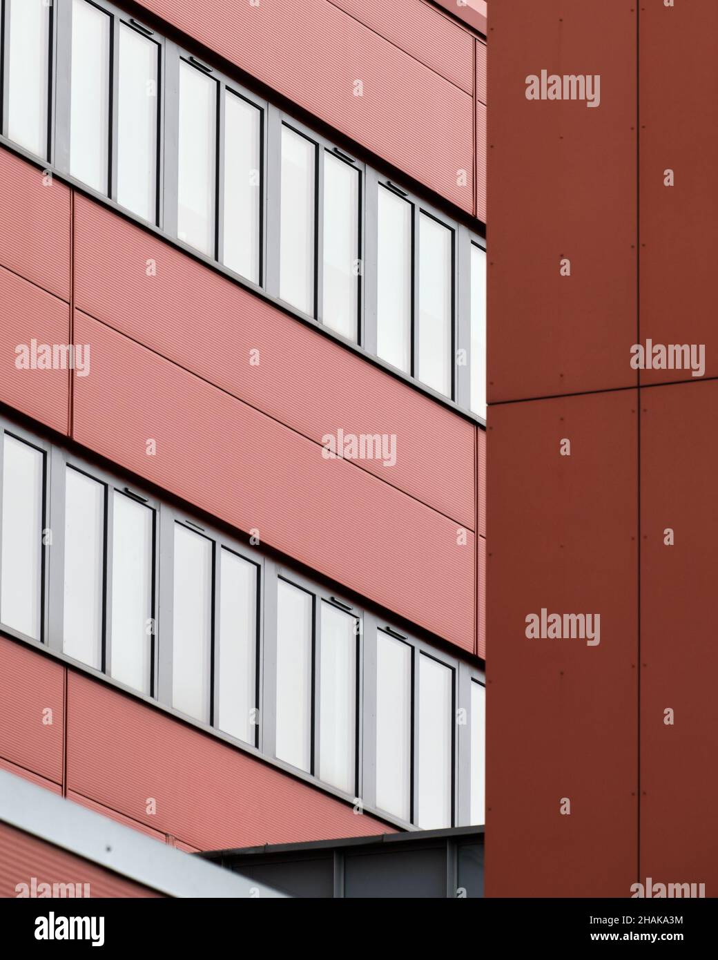 Exterior of a red modern building Stock Photo - Alamy