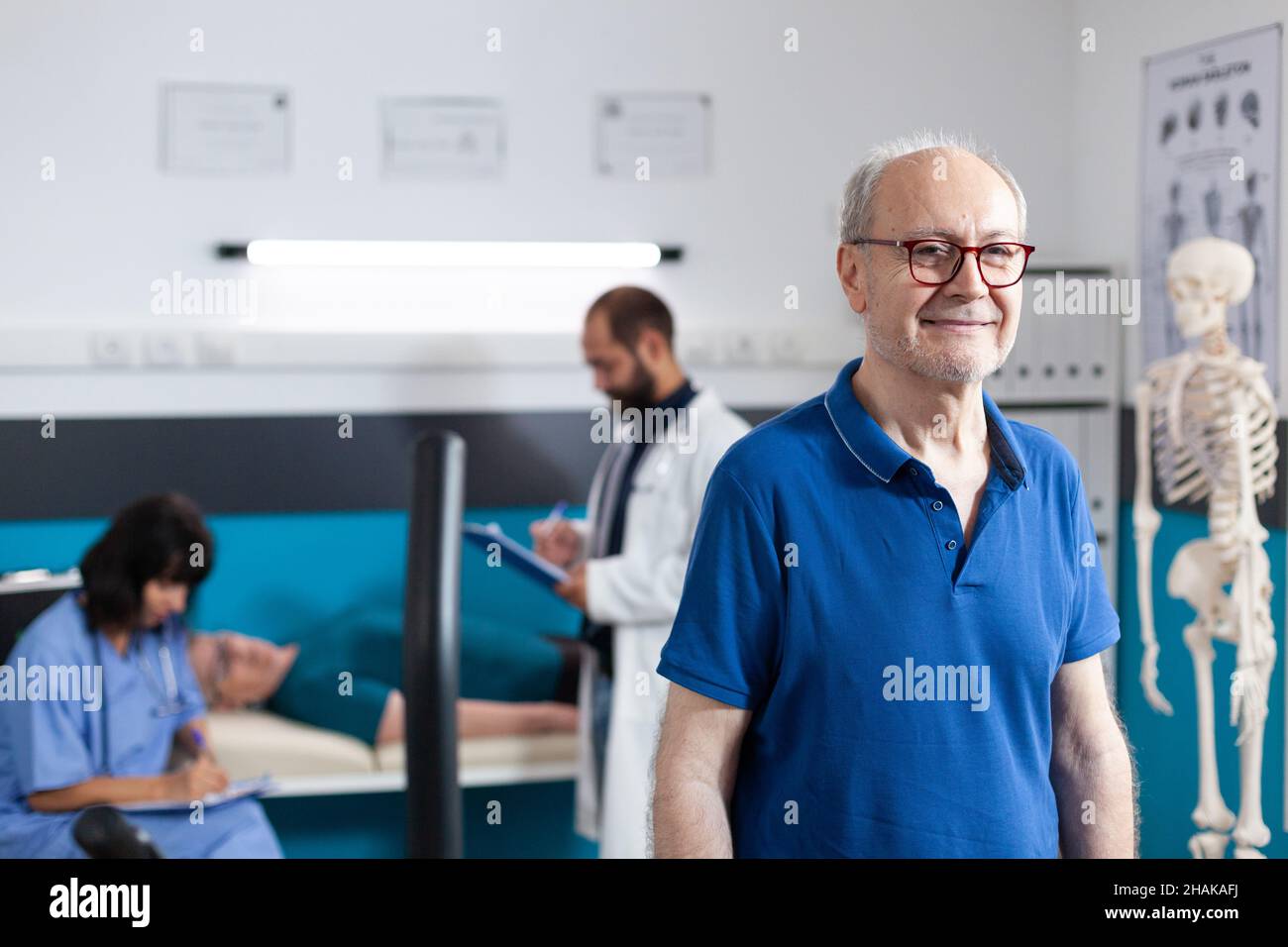 Portrait of retired patient at physiotherapy clinic for recovery ...