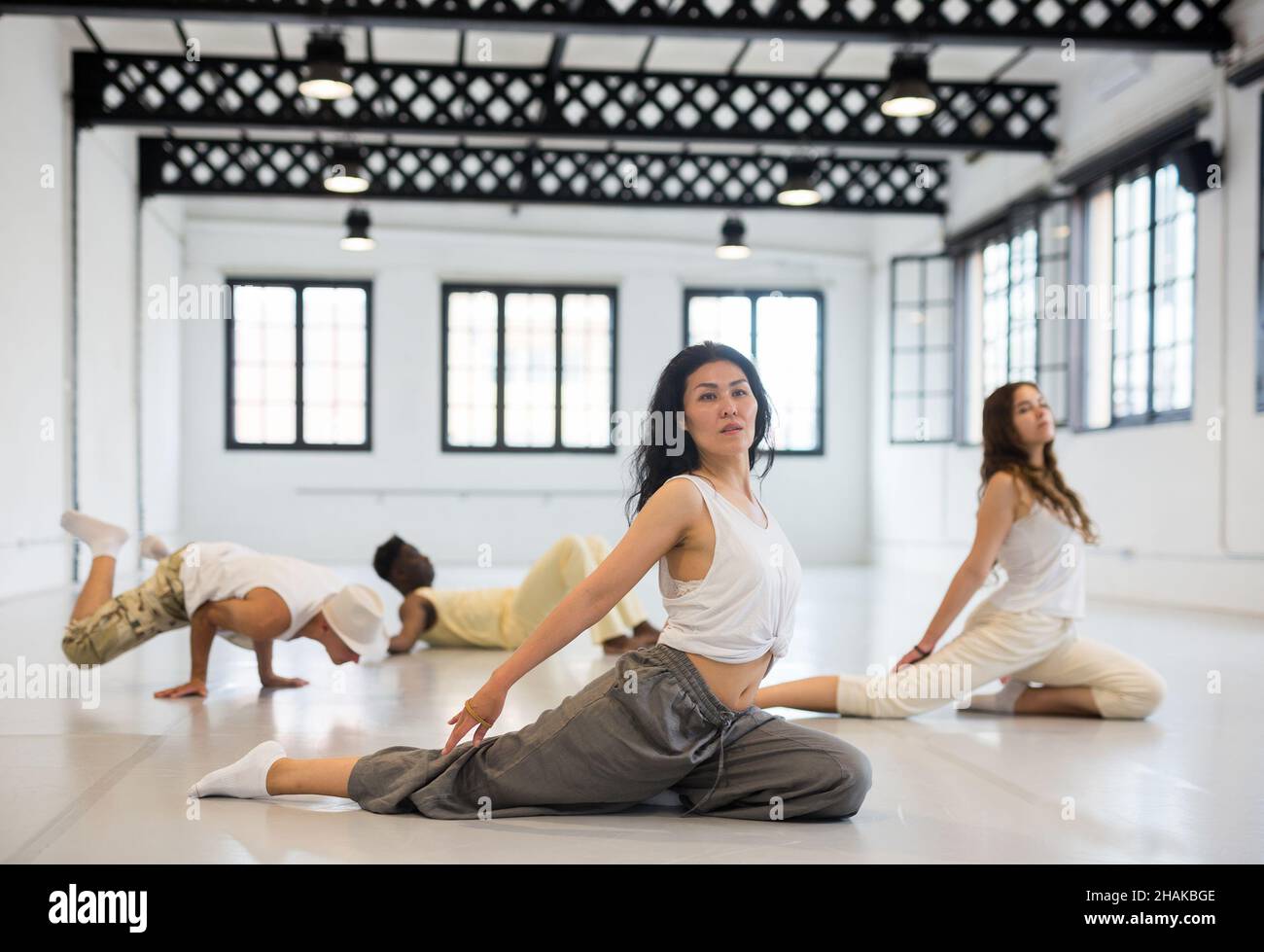 Dancers training contemporary dance movements during rehearsal Stock ...
