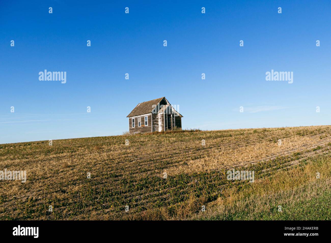 An old country church in the Great Plains during sunset with fall ...