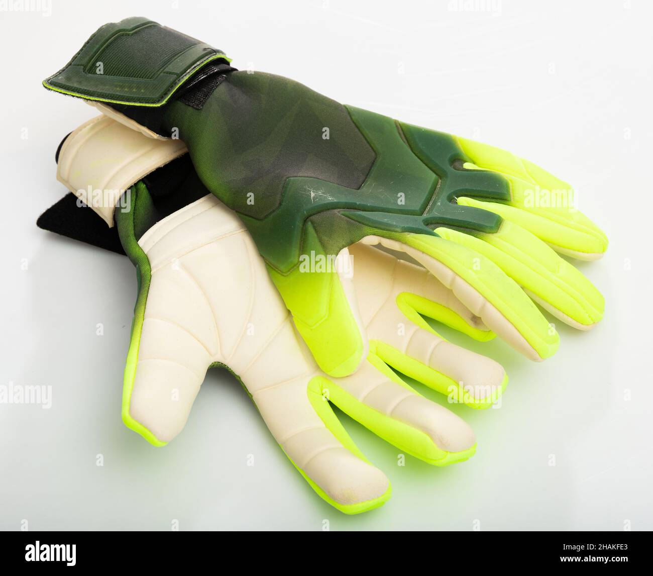 Closeup of pair of goalkeeper gloves isolated on white background ...