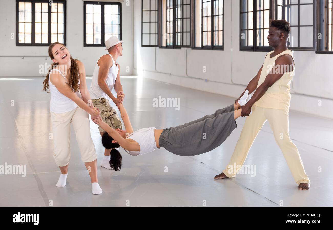 Team of artists rehearsing spectacle scene in big ballroom Stock Photo ...