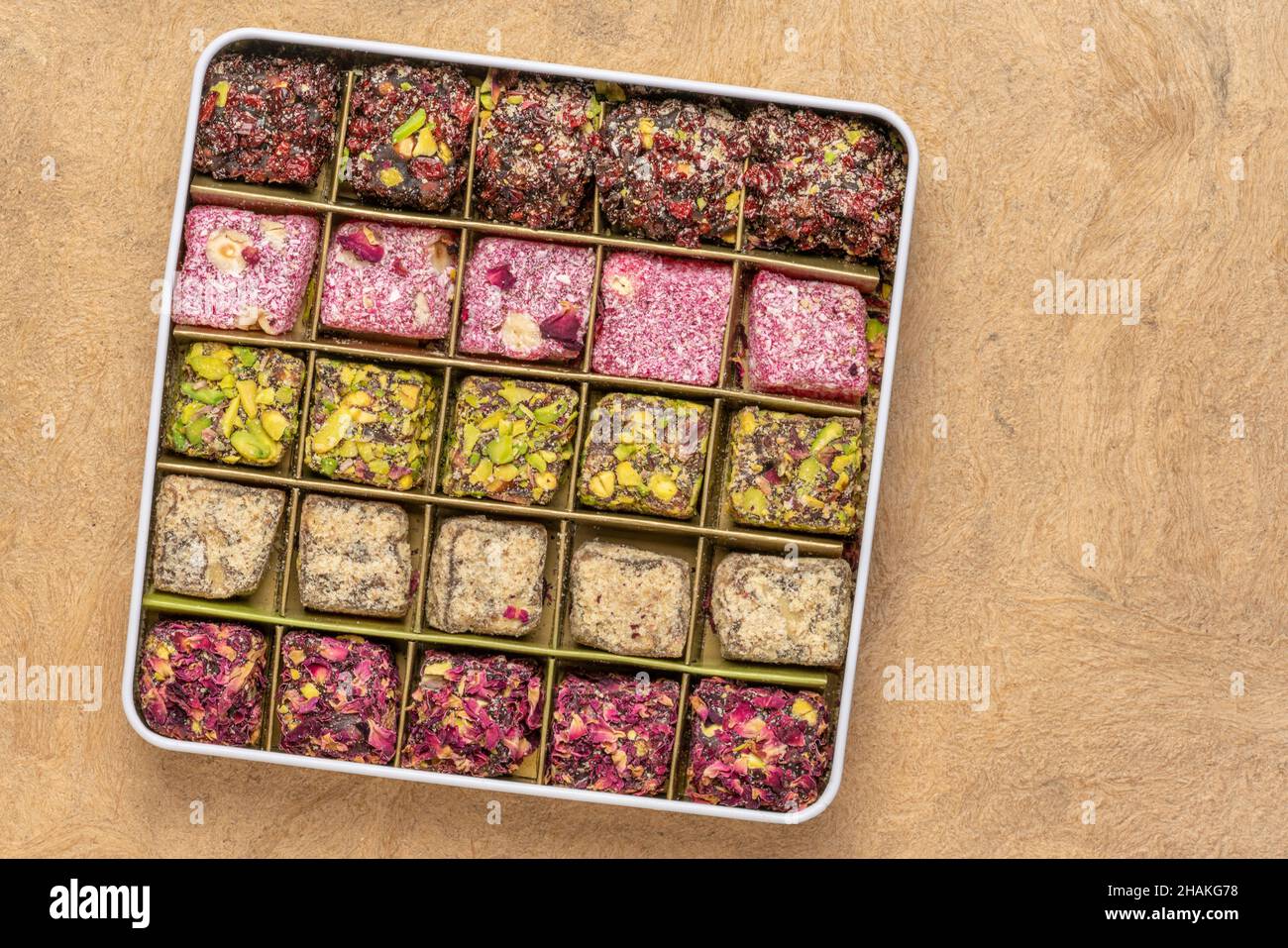 assortment of traditional Turkish delight (lokum) in a tin box against ...