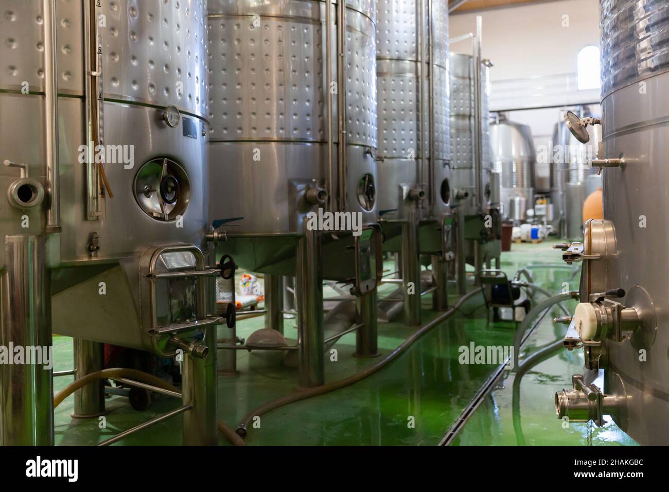 Stainless steel storage vats for wine production at winery Stock Photo ...