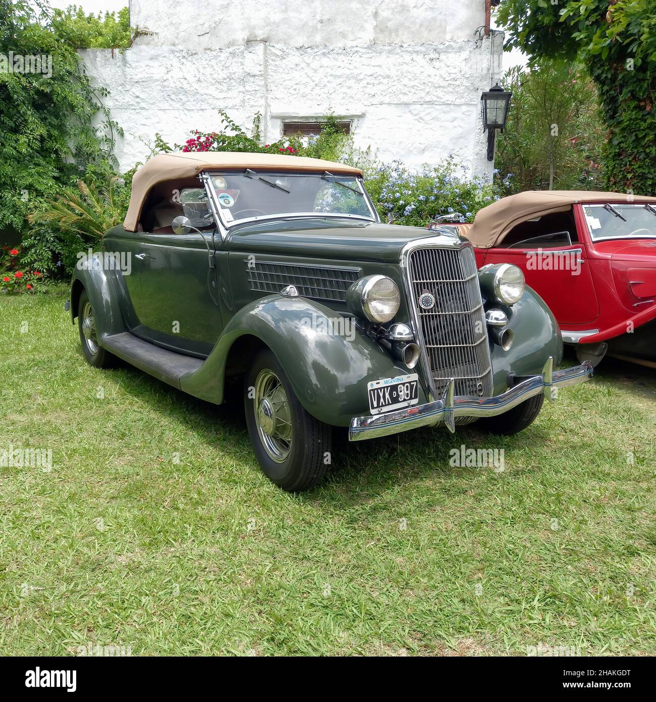 LOMAS DE ZAMORA - BUENOS AIRES, ARGENTINA - Dec 10, 2021: vintage green Ford Model 48 V8 two ...