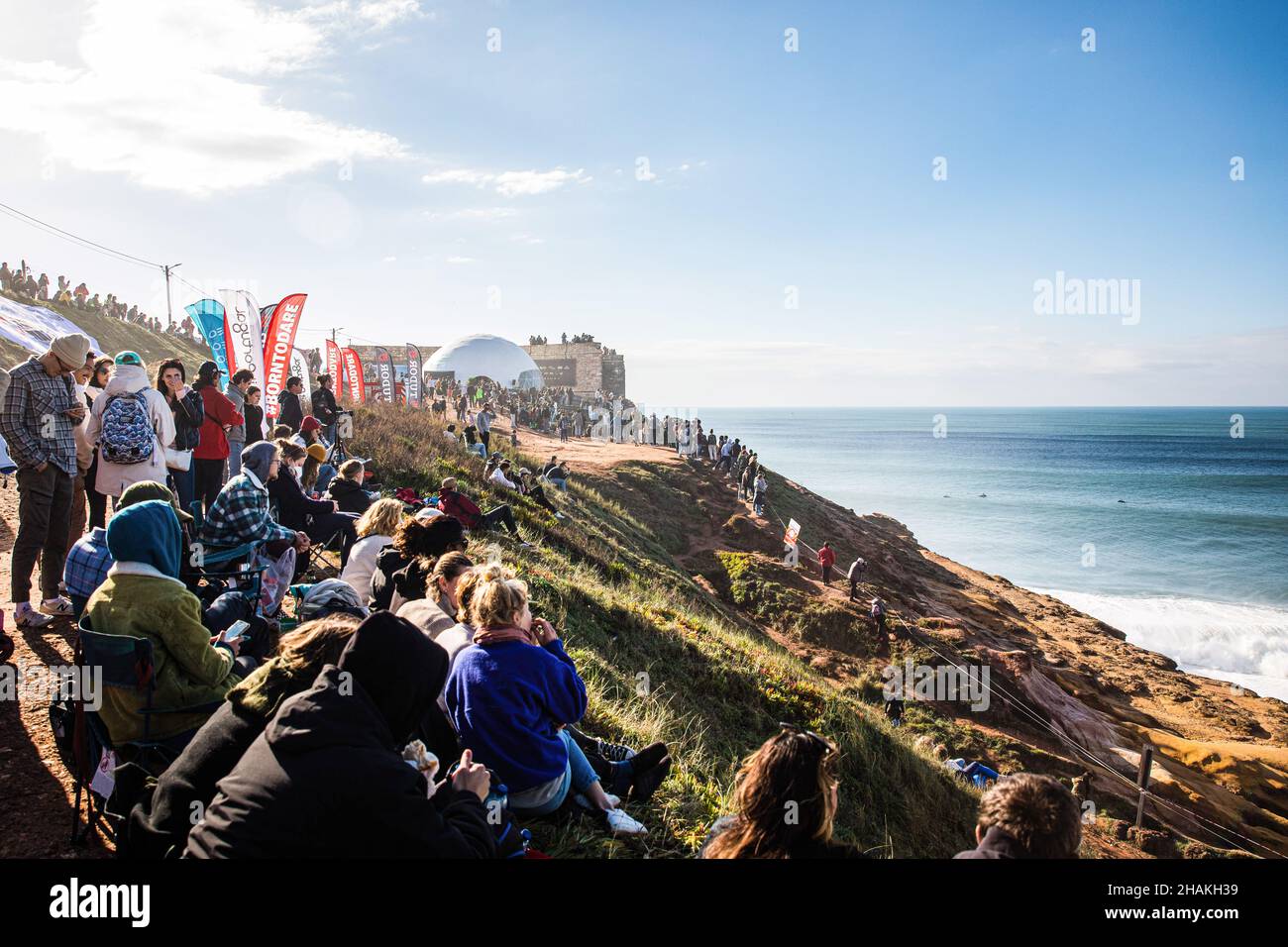 Thousands of people watch the Big Wave surfing competition from the ...