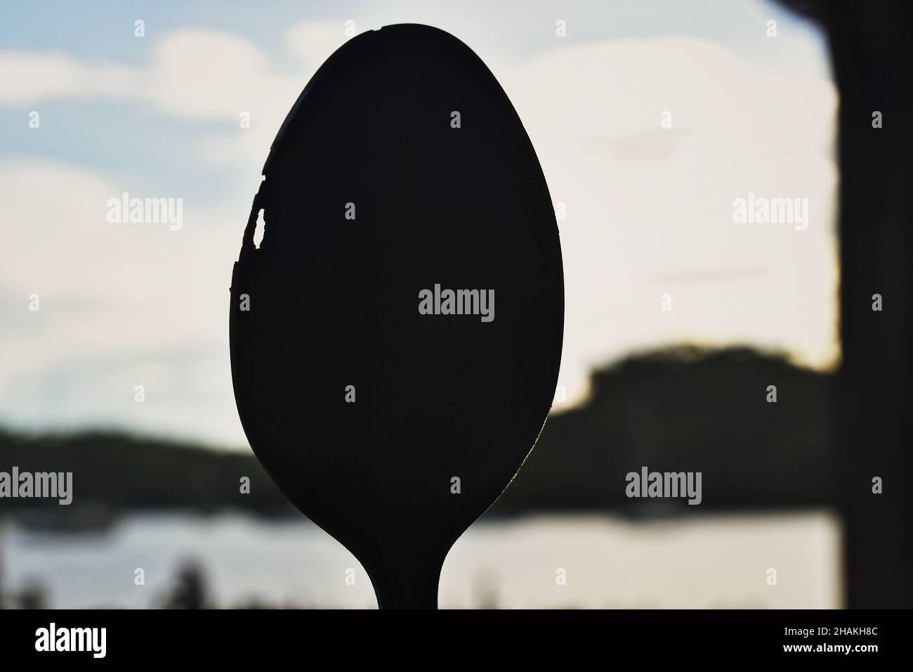 Closeup shot of a broken spoon silhouette Stock Photo - Alamy