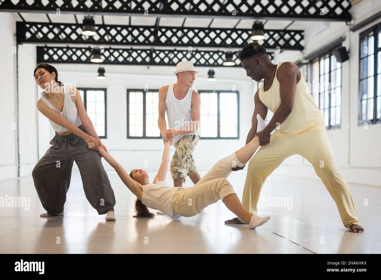 Modern ballet dancers doing lifting pose during studying contemporary ...