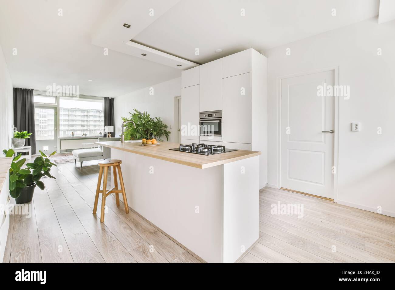 Cozy and strong kitchen area in daylight with flowers Stock Photo - Alamy
