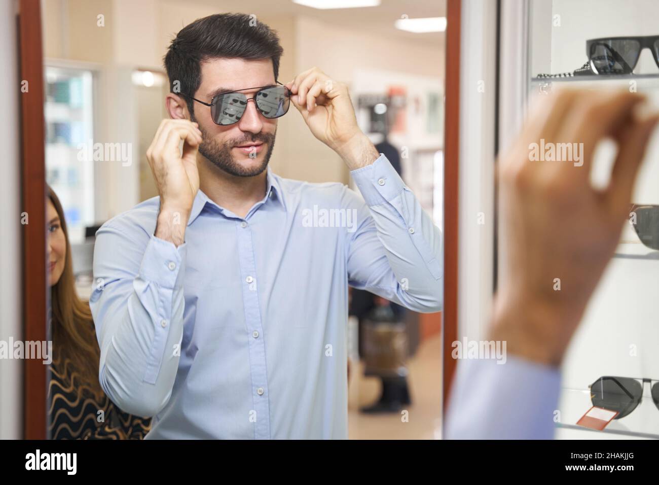 Trying on glasses in mirror hi-res stock photography and images - Alamy