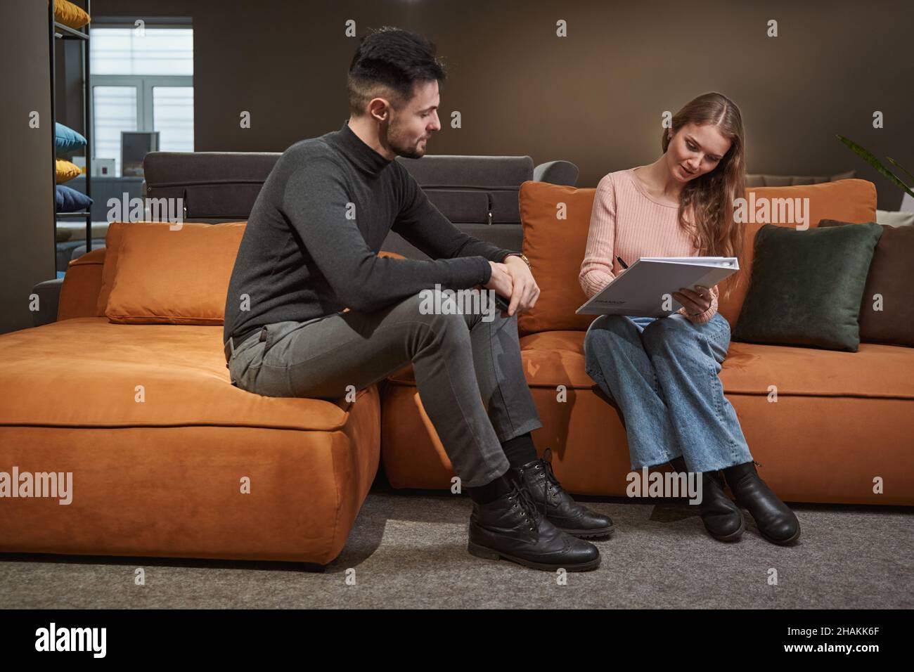 Concentrated furniture buyer setting signature to document Stock Photo ...