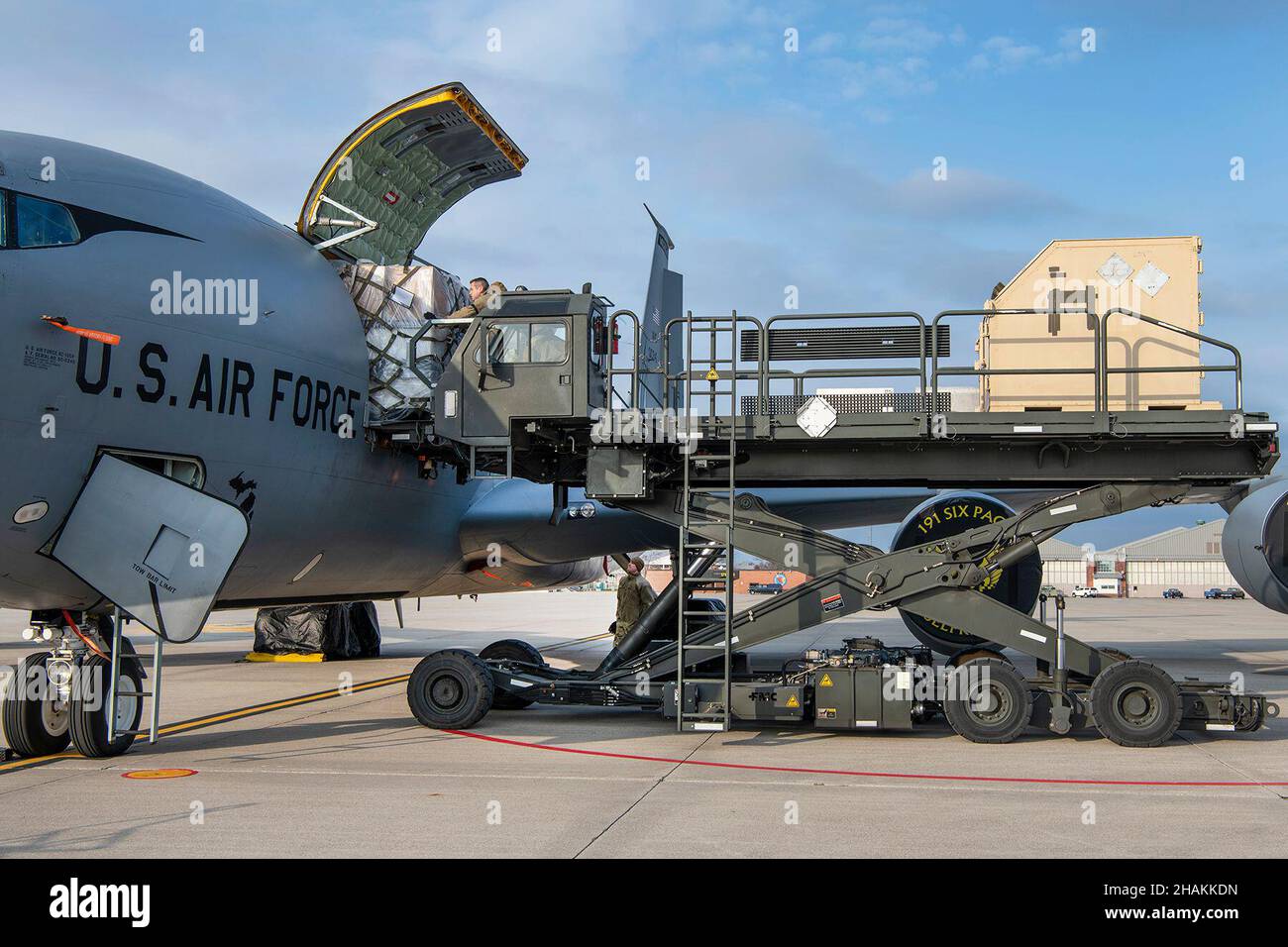 Airmen from the 127th Logistics Readiness Squadron push a pallet of ...