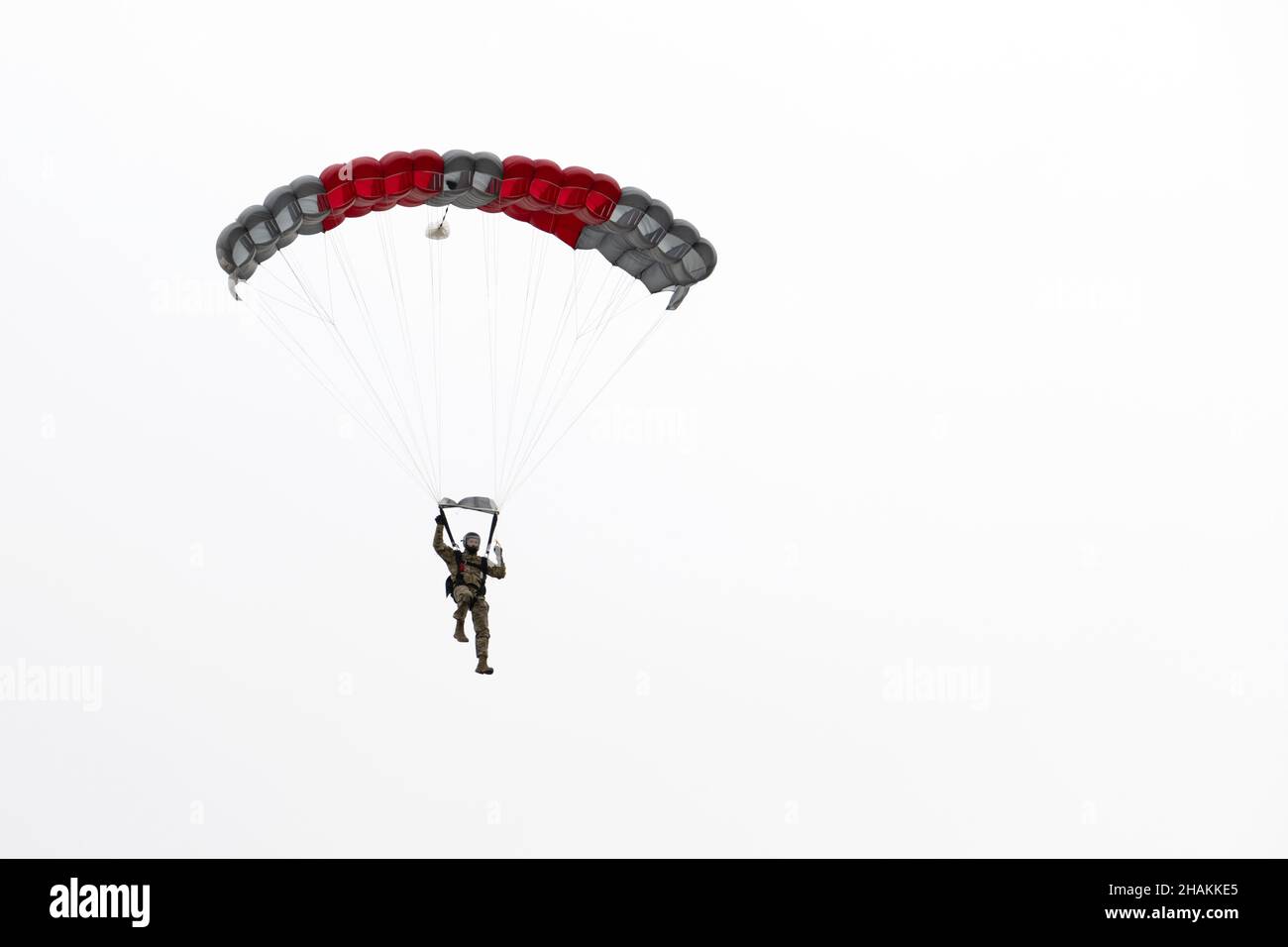 A U.S. Air Force Airman assigned to the 57th Rescue Squadron parachutes ...