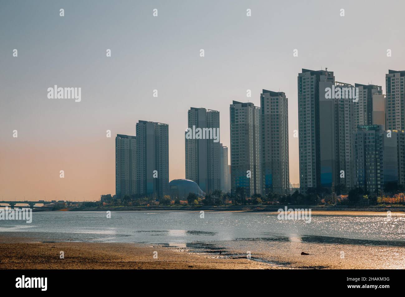 Apartment buildings and sea near Sorae port with sunset sky in Incheon ...