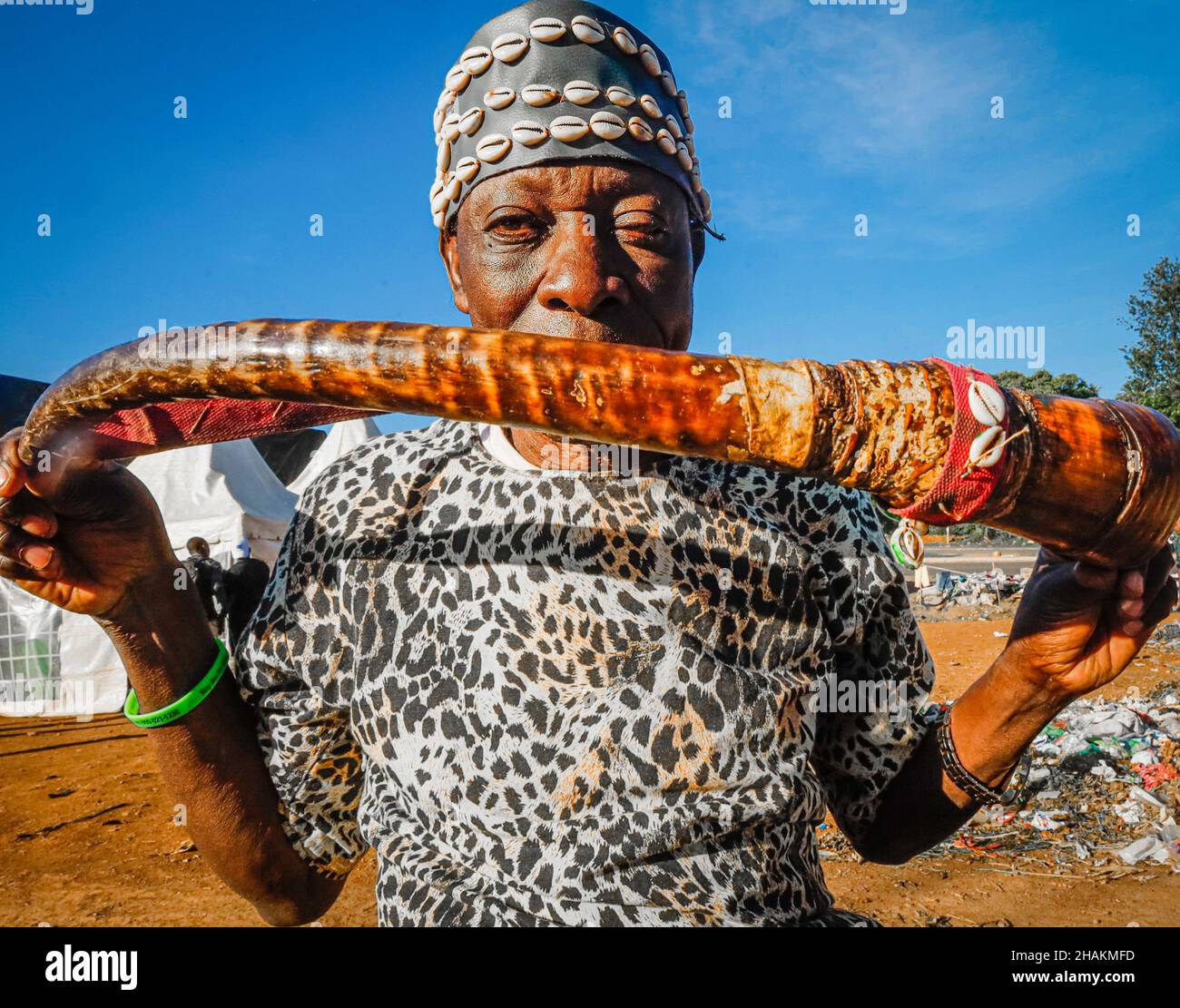 A traditional instrumentalist plays his (Oporo, Mbiu horn) traditional ...