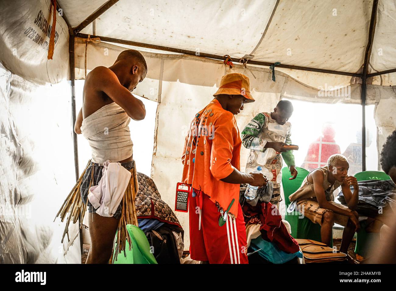 Nairobi, Kenya. 11th Dec, 2021. Young male models change into their ...