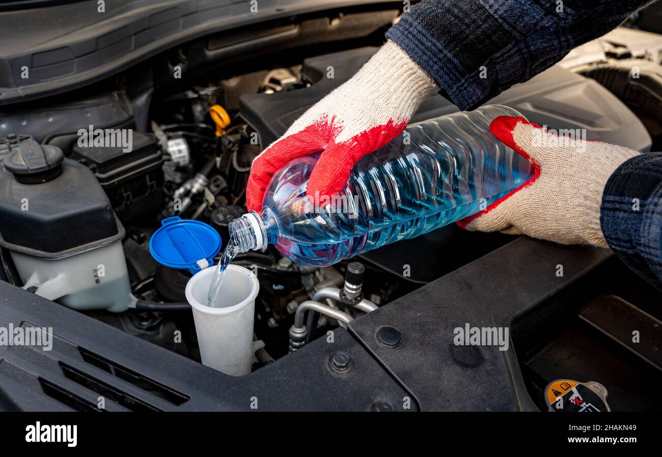 Filling windshield washer fluid hi-res stock photography and images - Alamy
