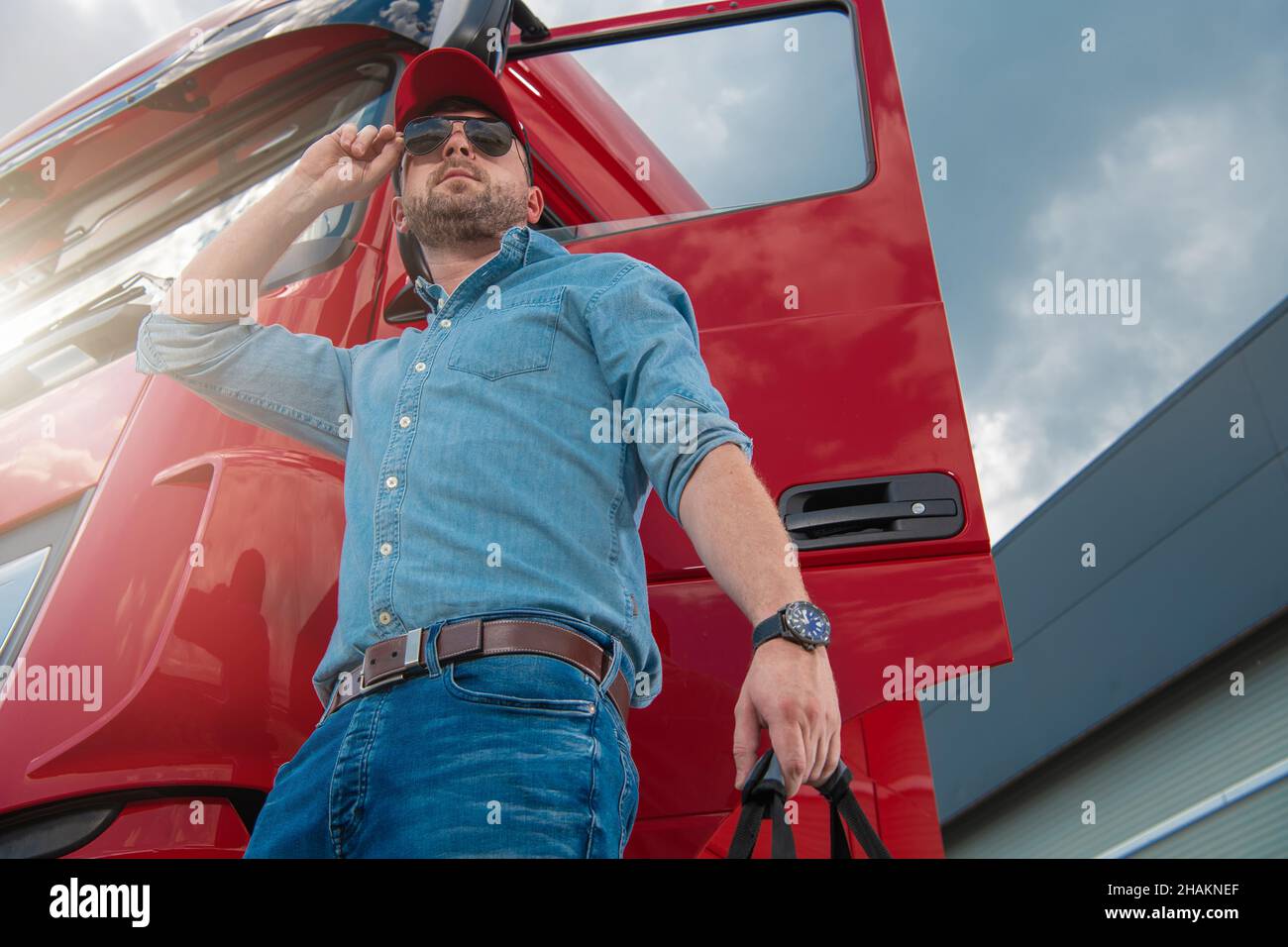 Caucasian Modern Semi Tractor Truck Driver. Trucker in His 30s in Front ...