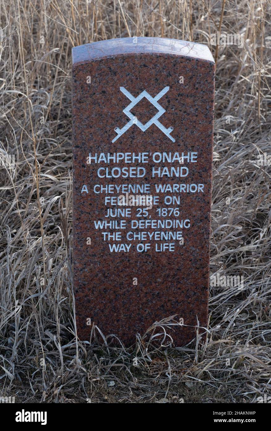 Red marble tombstone for Closed Hand, a Cheyenne warrior who died at ...