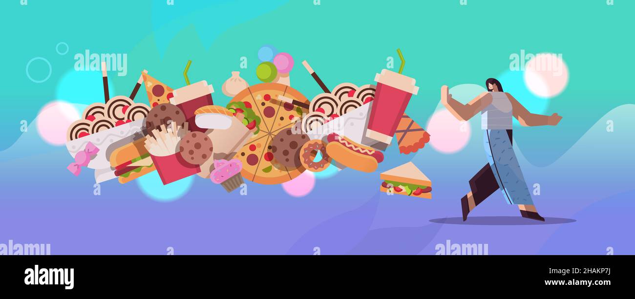 woman showing no stop gesture to junk food assortment of fast food ...