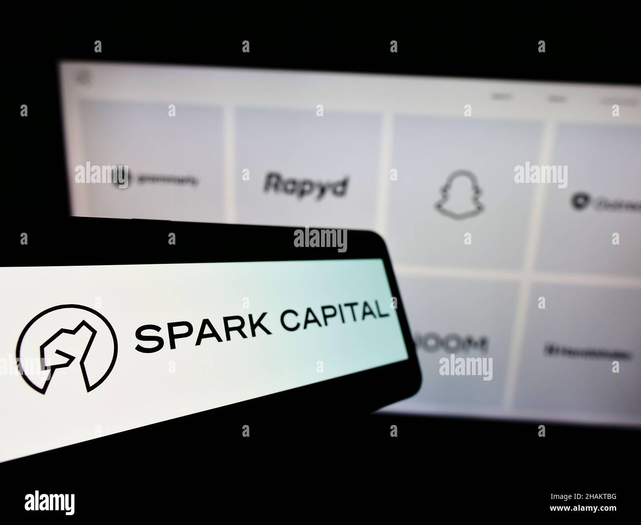Mobile phone with logo of US investment company Spark Capital Partners ...