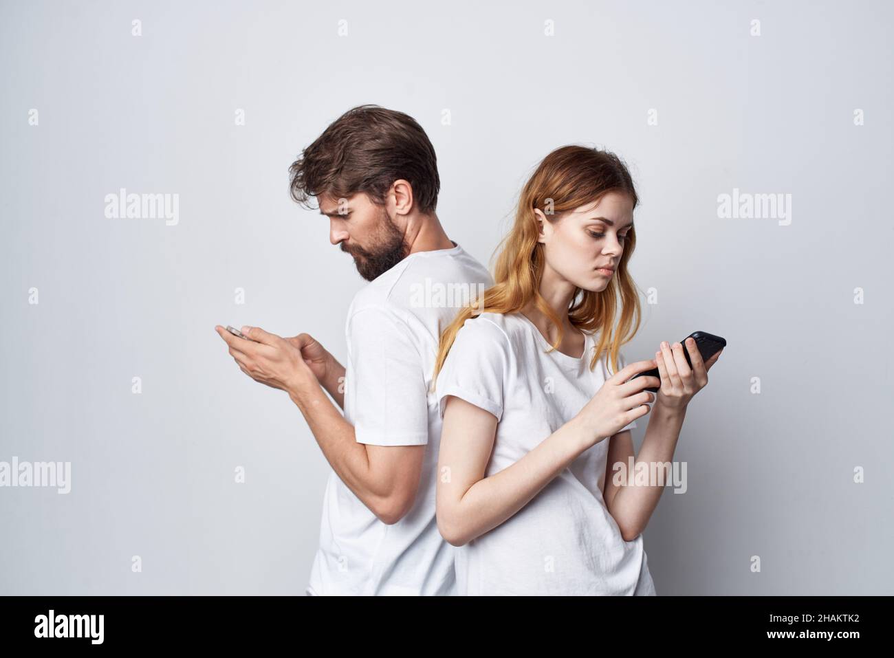 man and woman quarrel jealousy telephones communication light ...