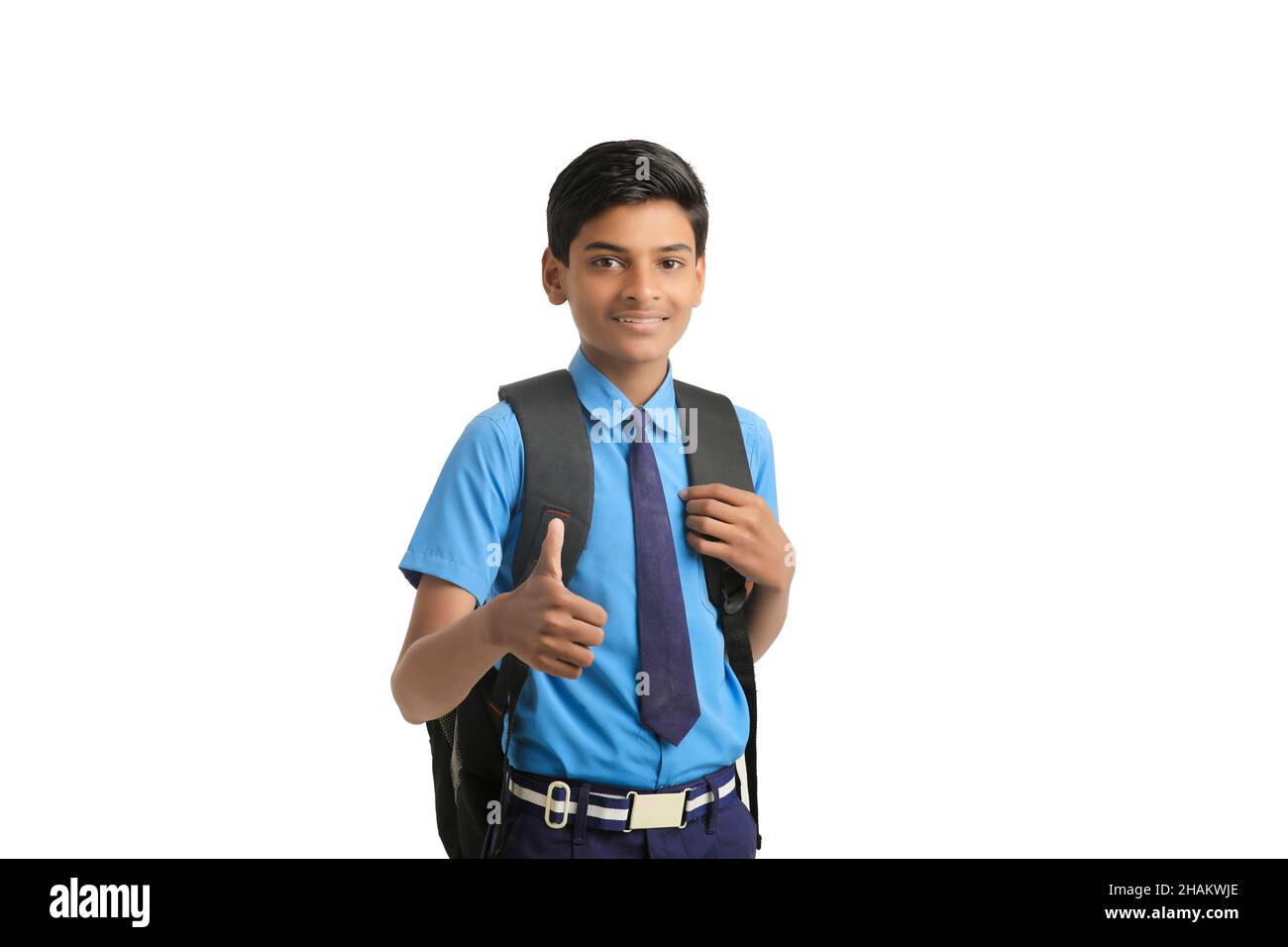 Indian school boy standing on white background Stock Photo - Alamy