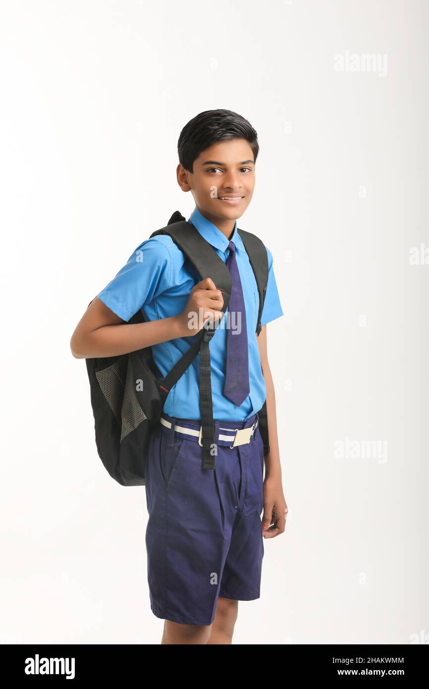Indian school boy standing on white background Stock Photo - Alamy