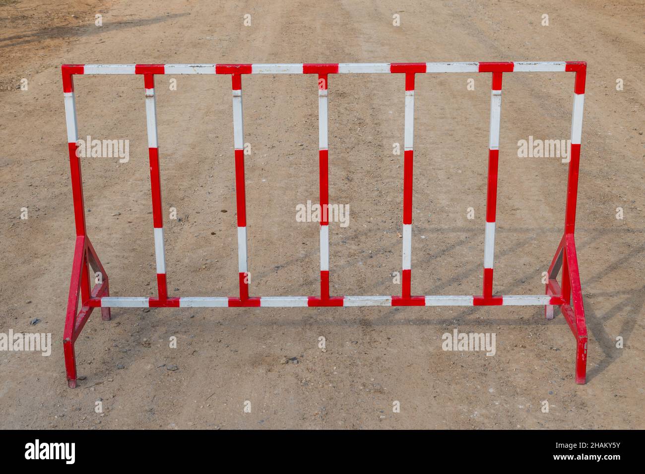 Red and white steel fence barrier restricted area Stock Photo - Alamy