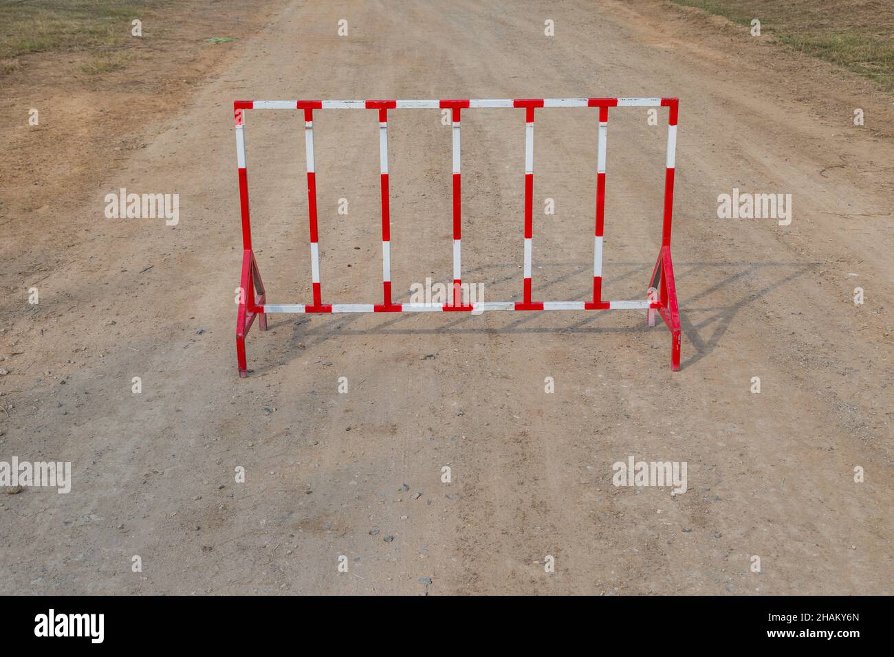 Red and white steel fence barrier restricted area Stock Photo - Alamy