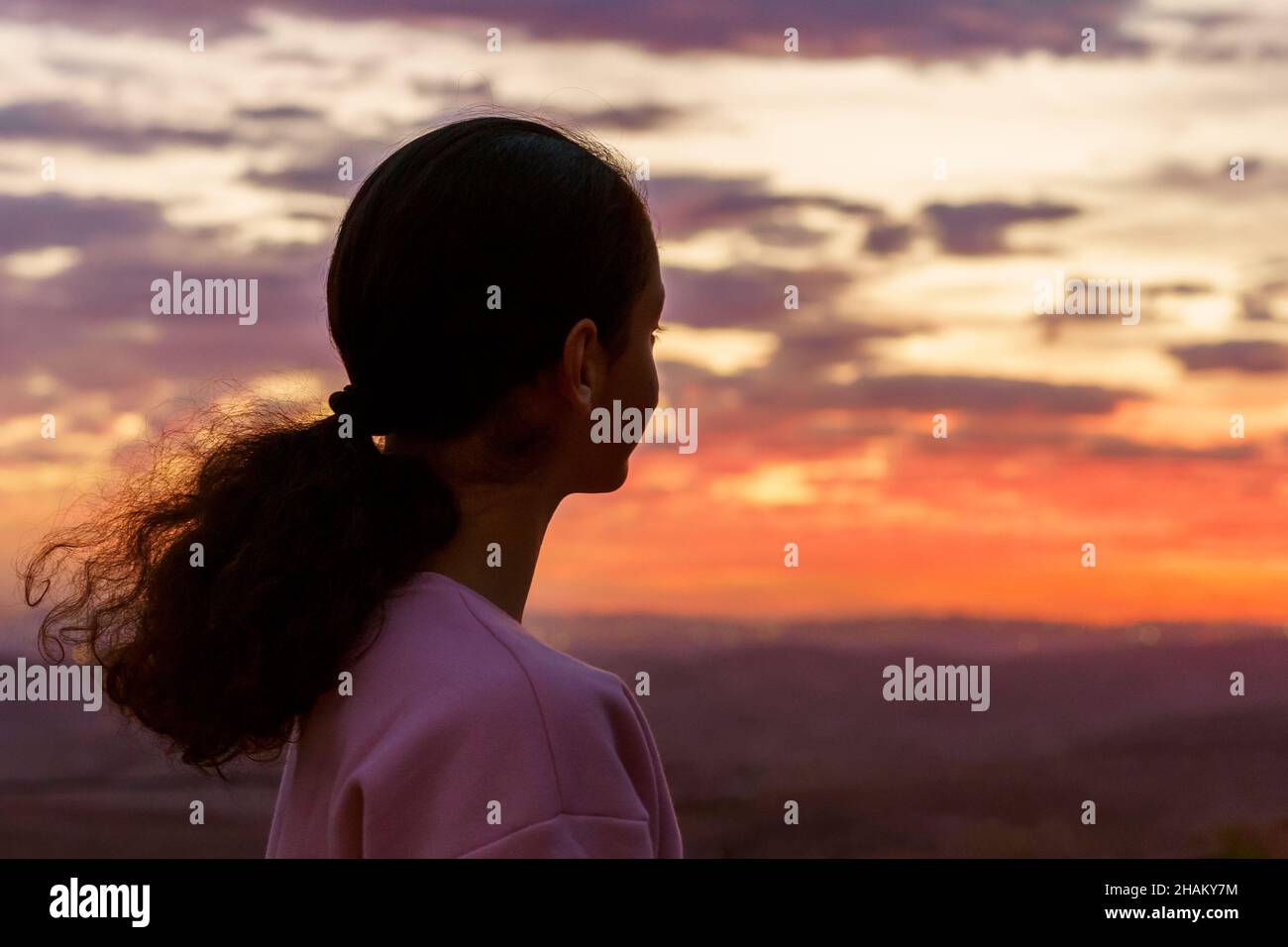 Side View Young Girl Enjoying The Amazing Sunset Stock Photo - Alamy