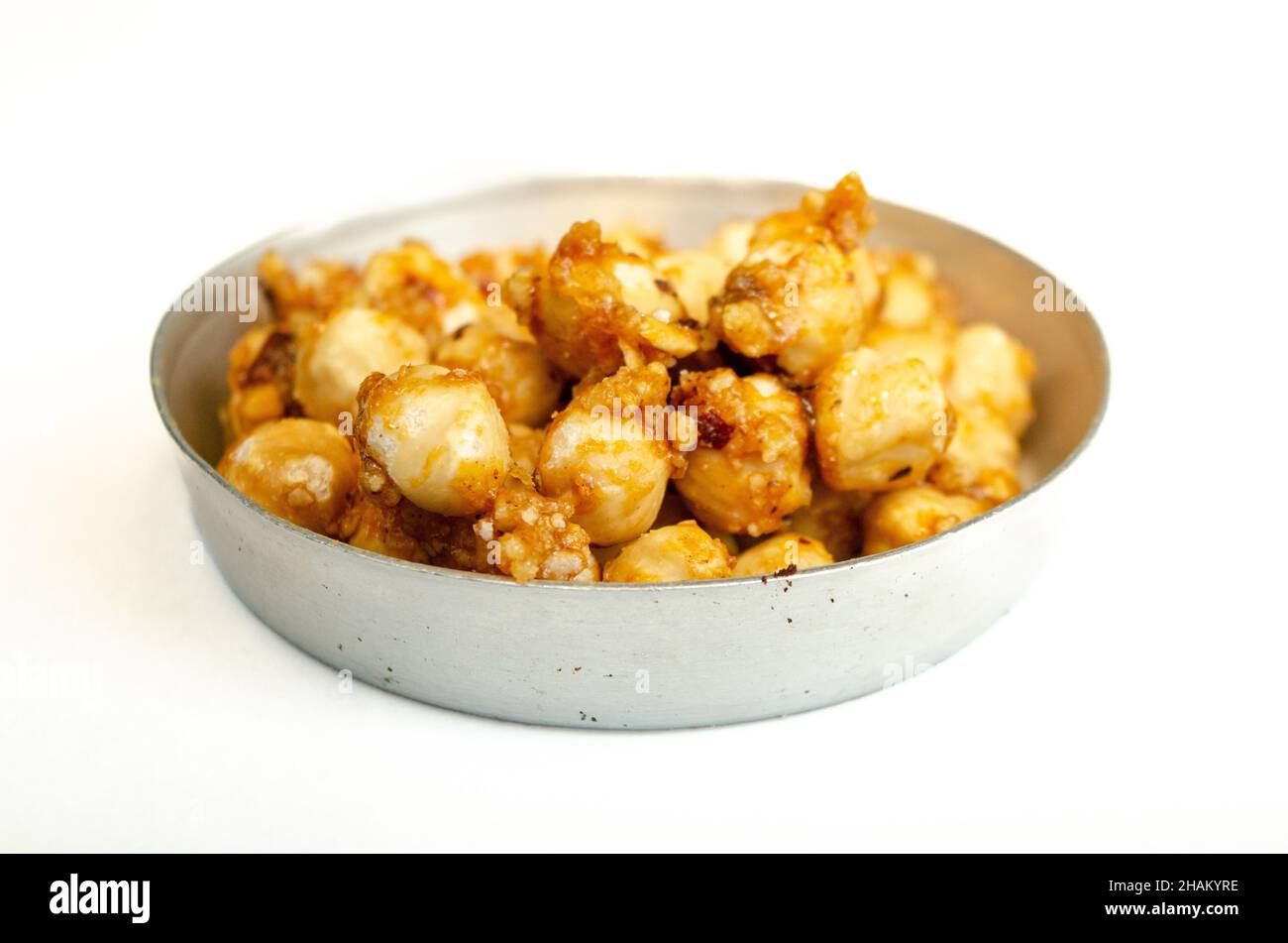 caramelized hazelnuts isolate on white Stock Photo - Alamy